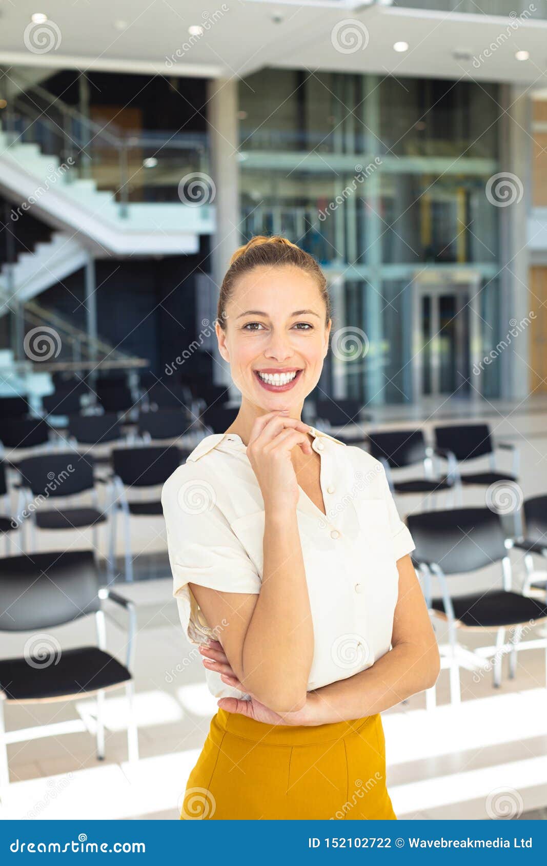 Young Caucasian Female Executive Looking at Camera while Standing in ...