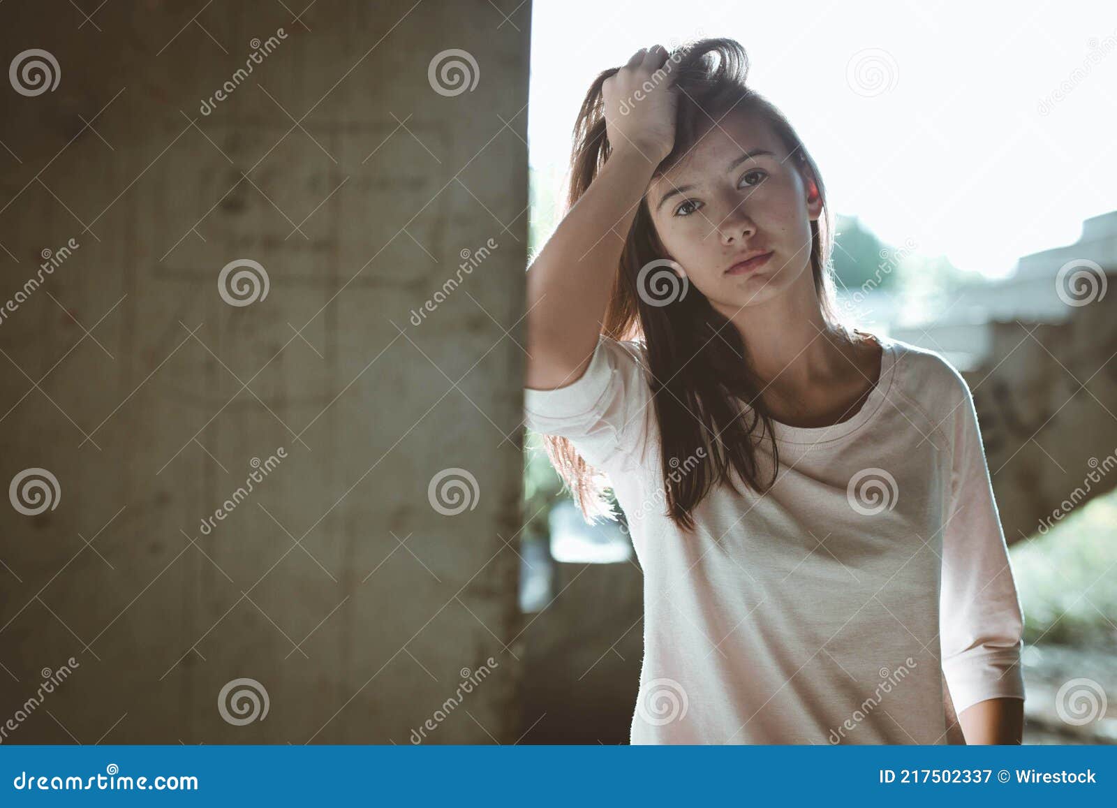 Young Caucasian Female Posing Leaning on a Wall Stock Image - Image of ...