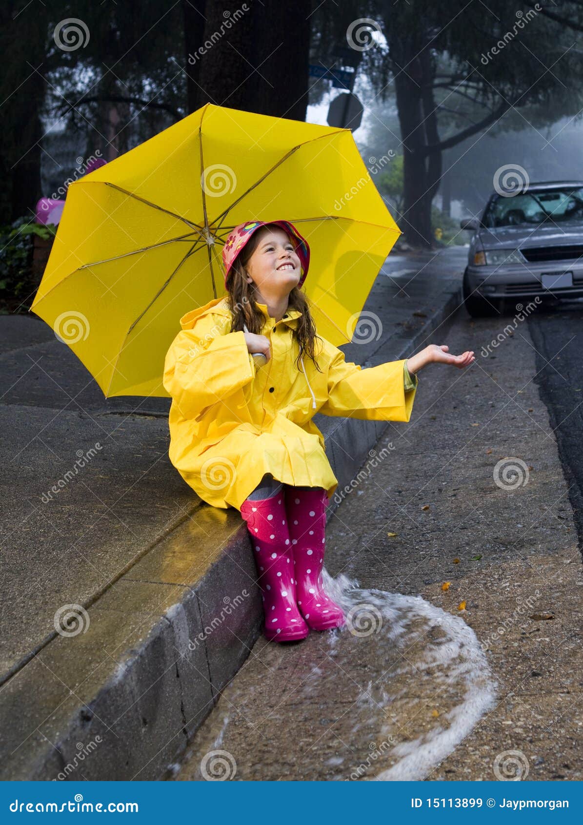 Young Caucasian Girl Playing in the Rain Stock Image - Image of yellow ...