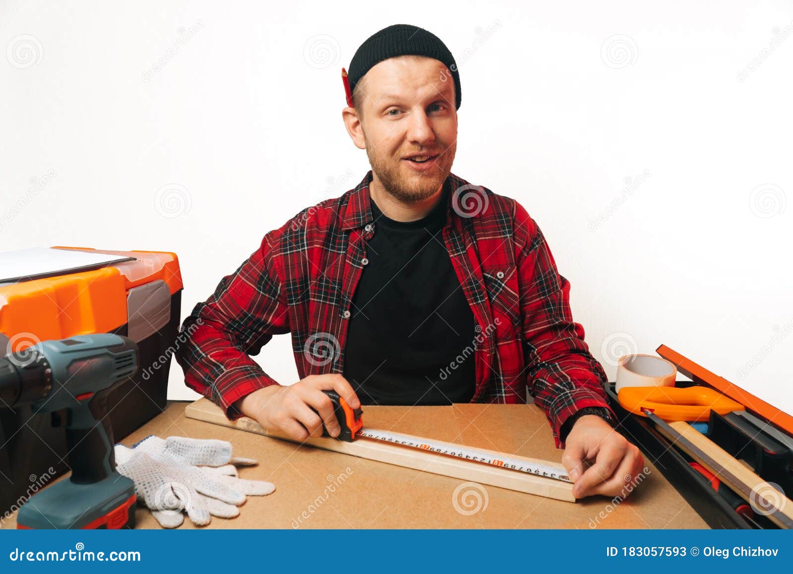 A Young Caucasian Guy a Carpenter with a Beard Works in a Carpentry ...