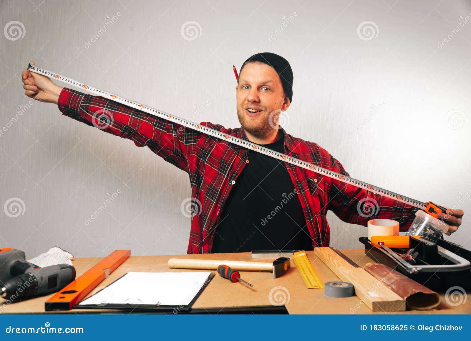 A Young Caucasian Guy a Carpenter with a Beard Works in a Carpentry ...