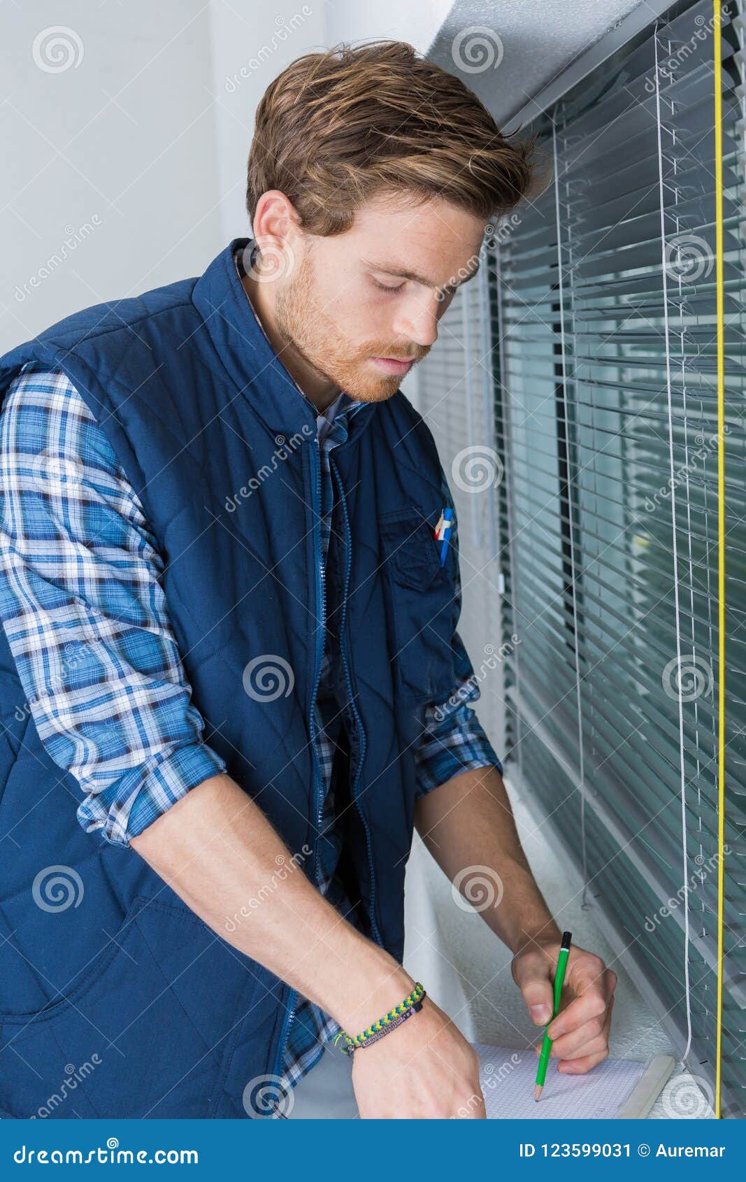 Young Caucasian Handsome Smiling Man Taking Notes before Action Stock ... Young Caucasian Handsome Smiling Man Taking Notes before Action Stock ...
