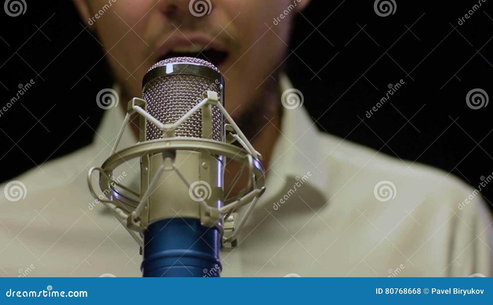 Young Caucasian Male Singer Performing at Studio with Microphone Stock ...