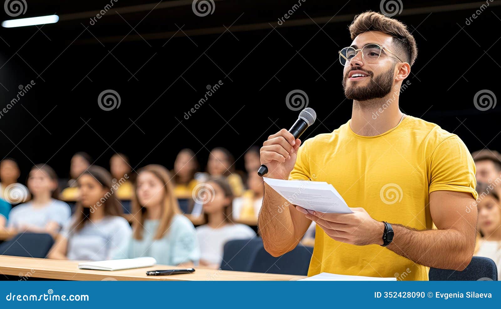 Young Caucasian Male Student Speaking in Lecture Hall with Microphone ...
