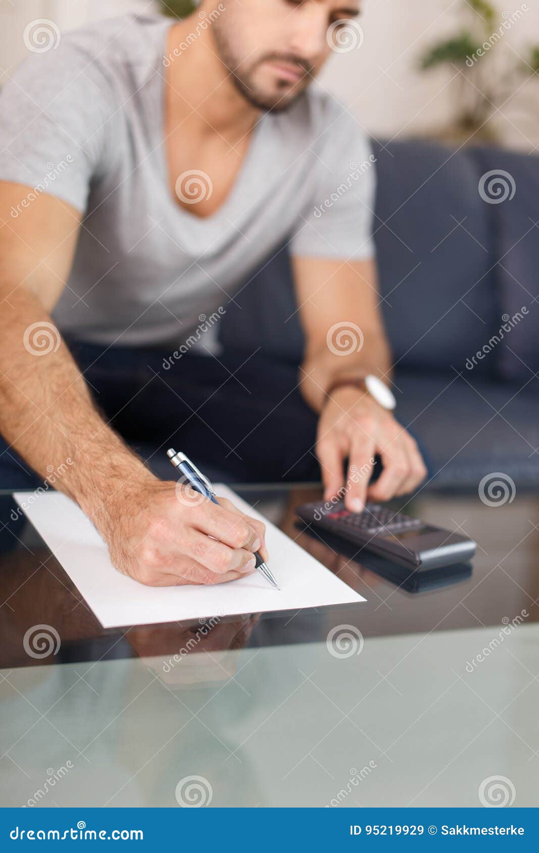 Young Caucasian Man Doing Calculation at Home Stock Image - Image of ...