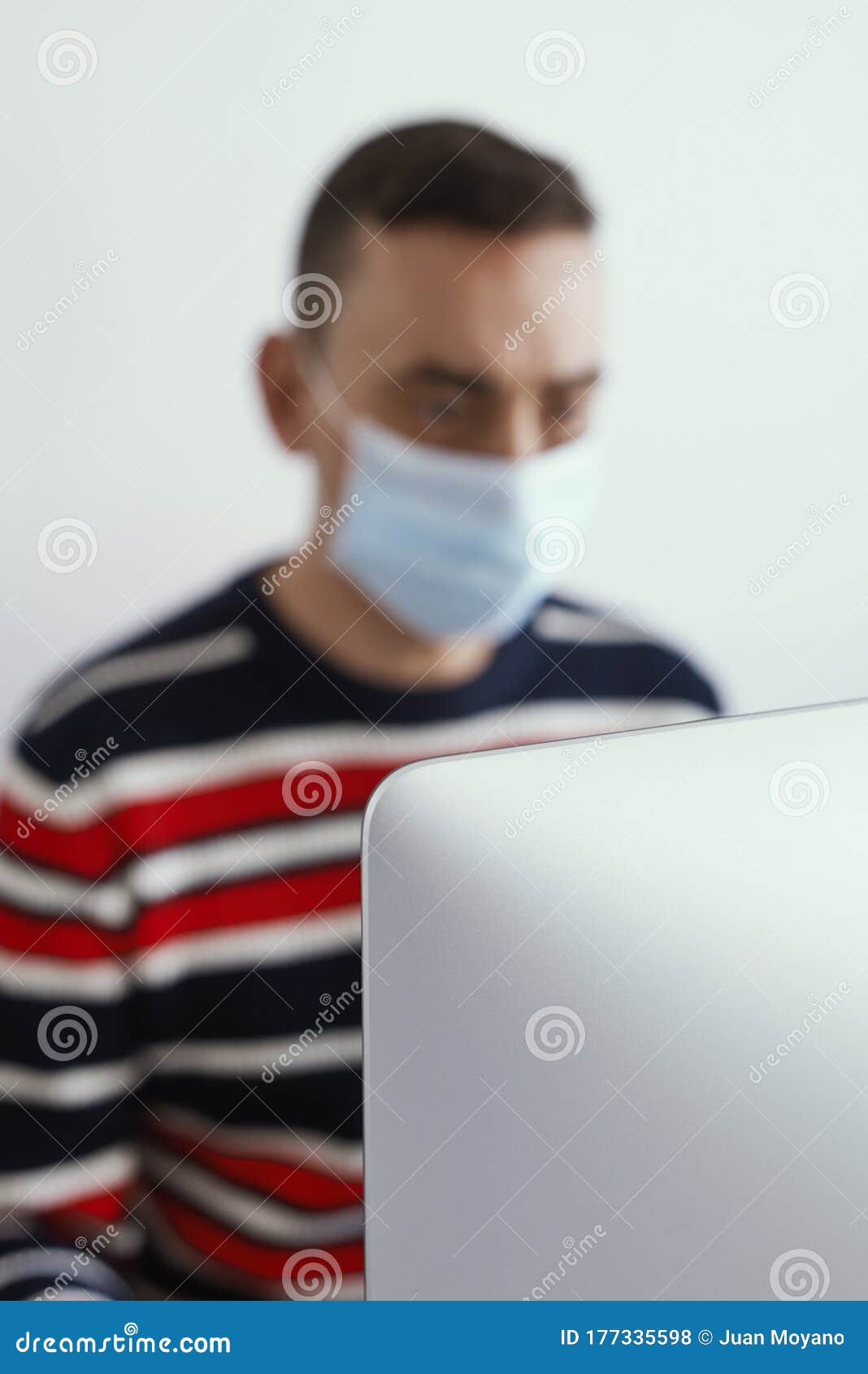 Man Using a Computer Wearing a Surgical Mask Stock Photo - Image of ...