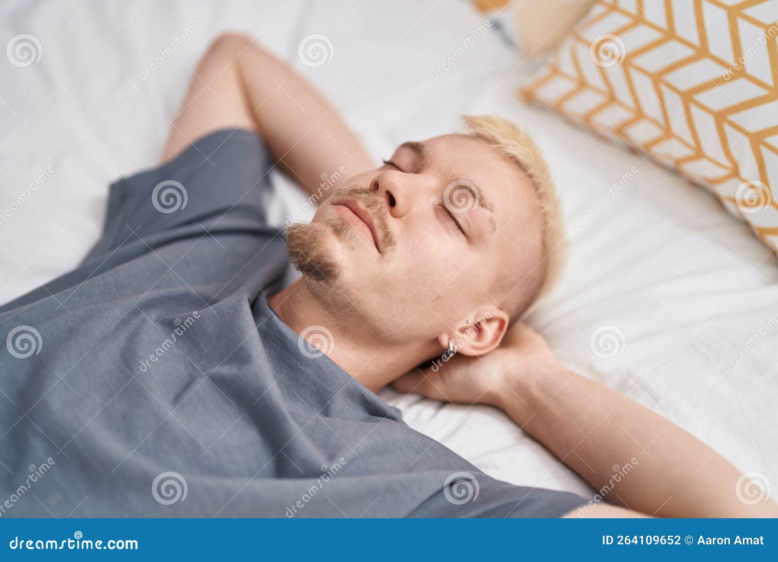 Young Caucasian Man Lying on Bed Sleeping at Bedroom Stock Photo ...