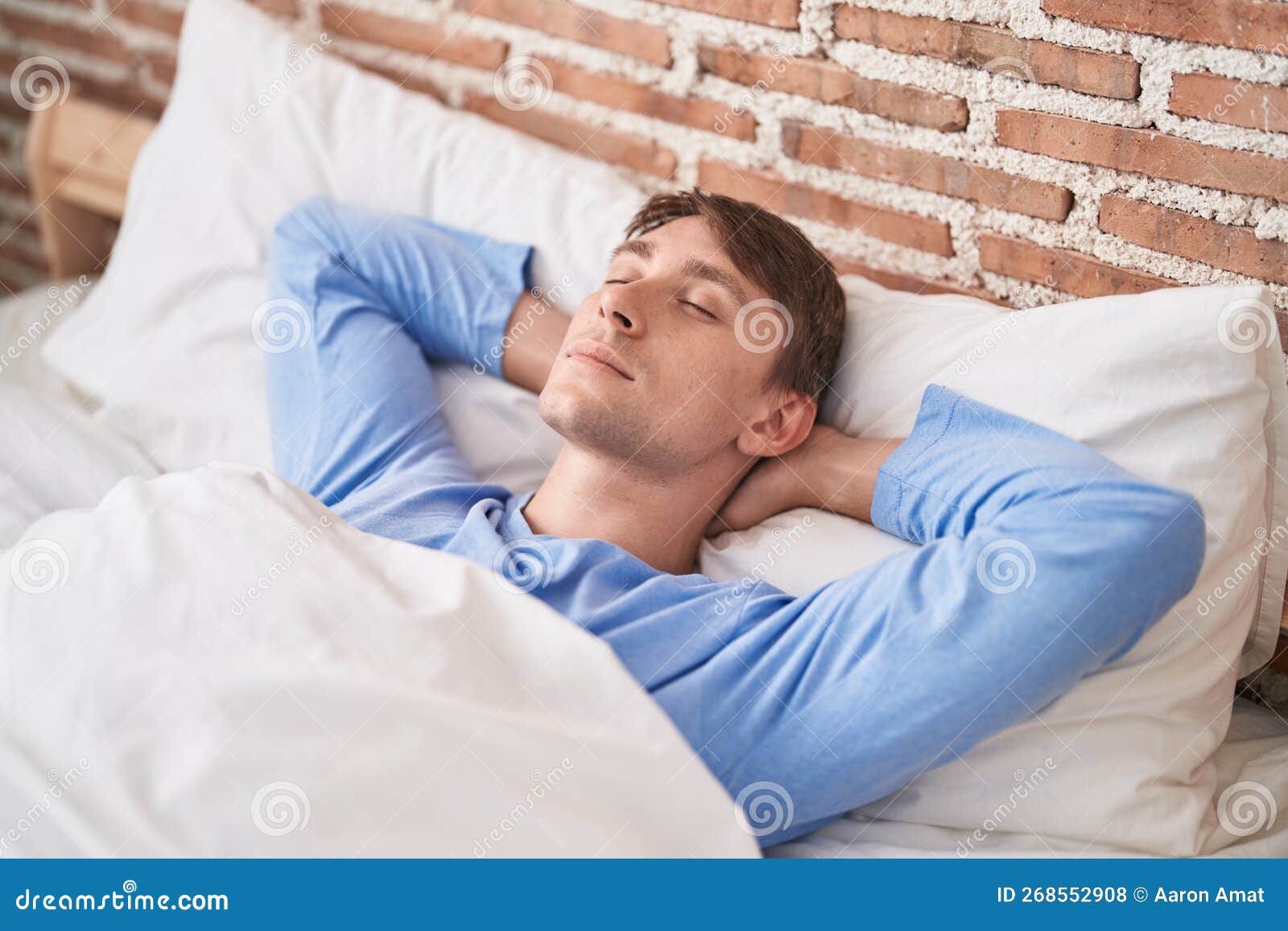 Young Caucasian Man Lying on Bed Sleeping at Bedroom Stock Photo ...