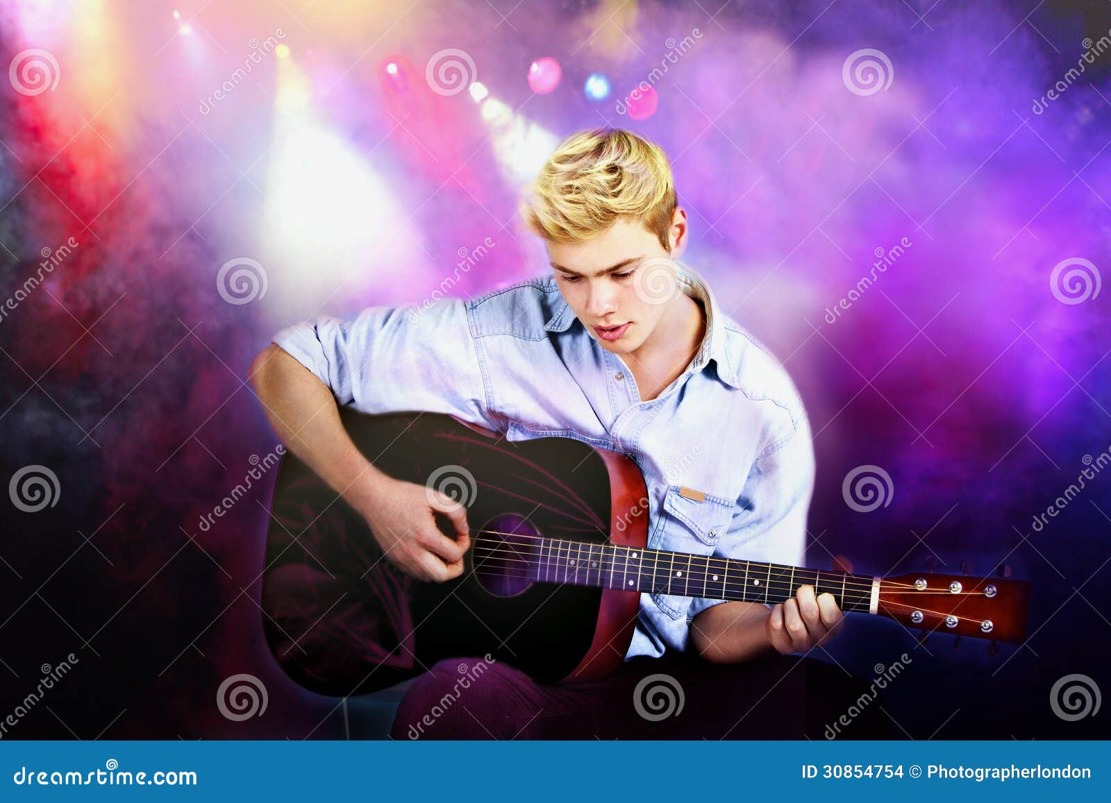 Young Caucasian Man Playing Guitar in Concert Stock Photo - Image of ...