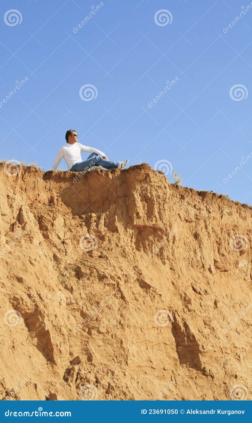 Young Caucasian Man Sitting Over the Rock Stock Photo - Image of male ...