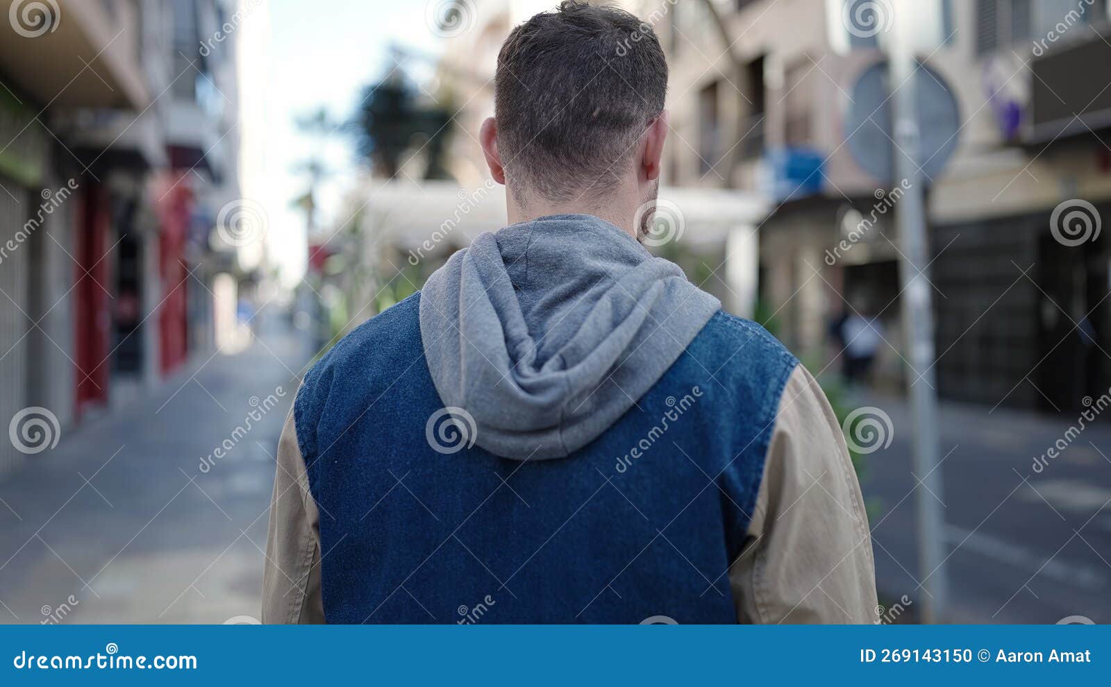 Young Caucasian Man Standing Backwards at Street Stock Photo - Image of ...