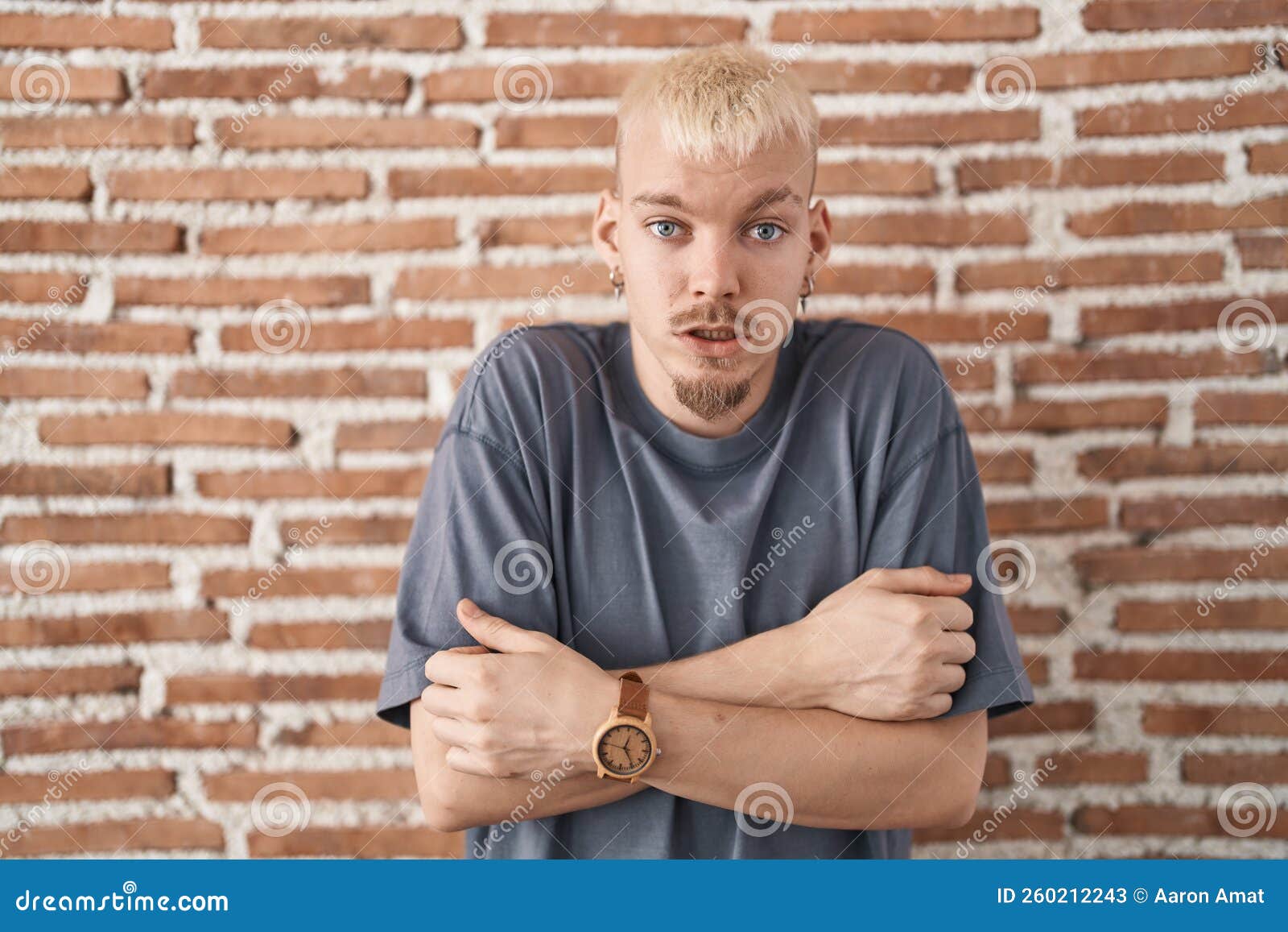 Young Caucasian Man Standing Over Bricks Wall Shaking and Freezing for ...