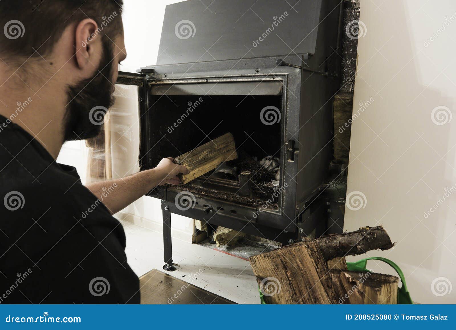Young Caucasian Man Starting a Fire in Fireplace Stock Photo - Image of ...