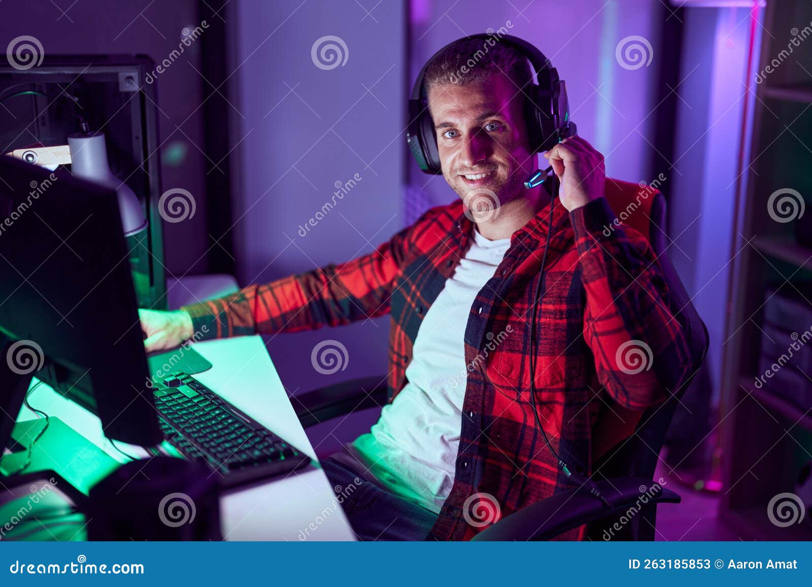 Young Caucasian Man Streamer Playing Video Game Using Computer at ...