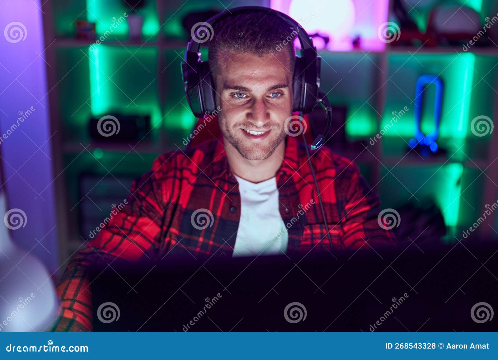 Young Caucasian Man Streamer Playing Video Game Using Computer at ...