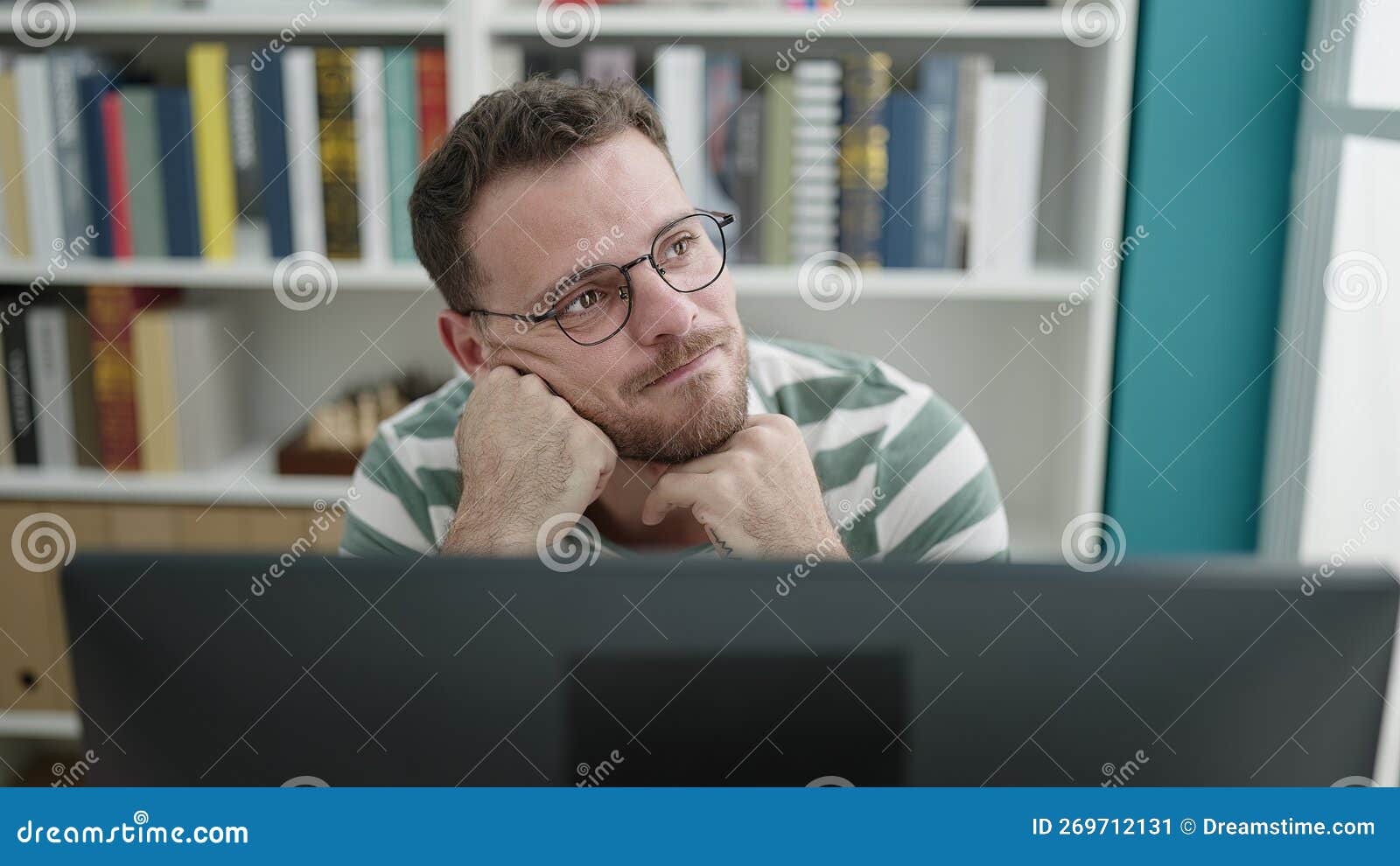 Young Caucasian Man Using Computer Thinking at Library University Stock ...