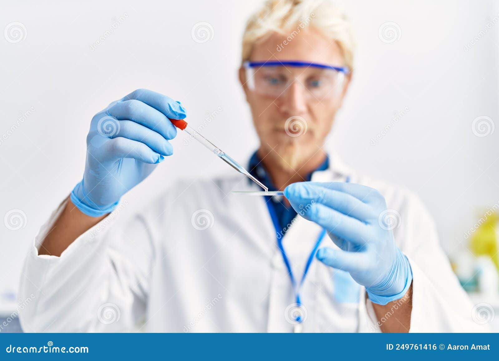 Young Caucasian Man Wearing Scientist Uniform Using Pipette at ...