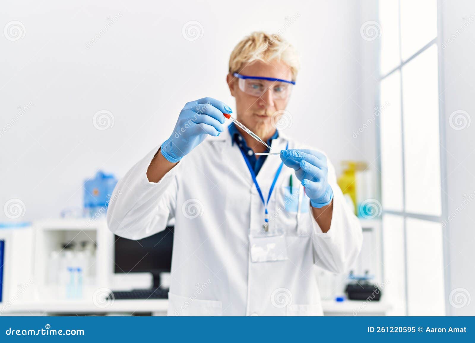 Young Caucasian Man Wearing Scientist Uniform Using Pipette at ...
