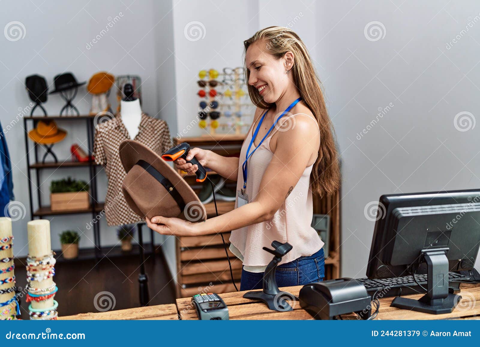 Young Caucasian Woman Shopkeeper Scanning Hat Using Barcode Reader at ...