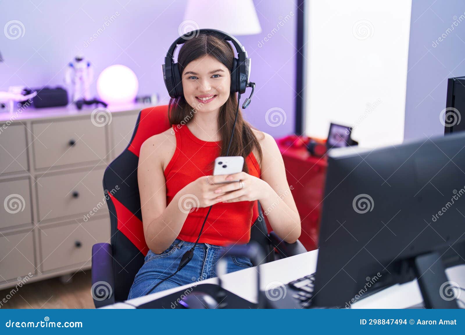 Young Caucasian Woman Streamer Using Computer and Smartphone at Gaming ...