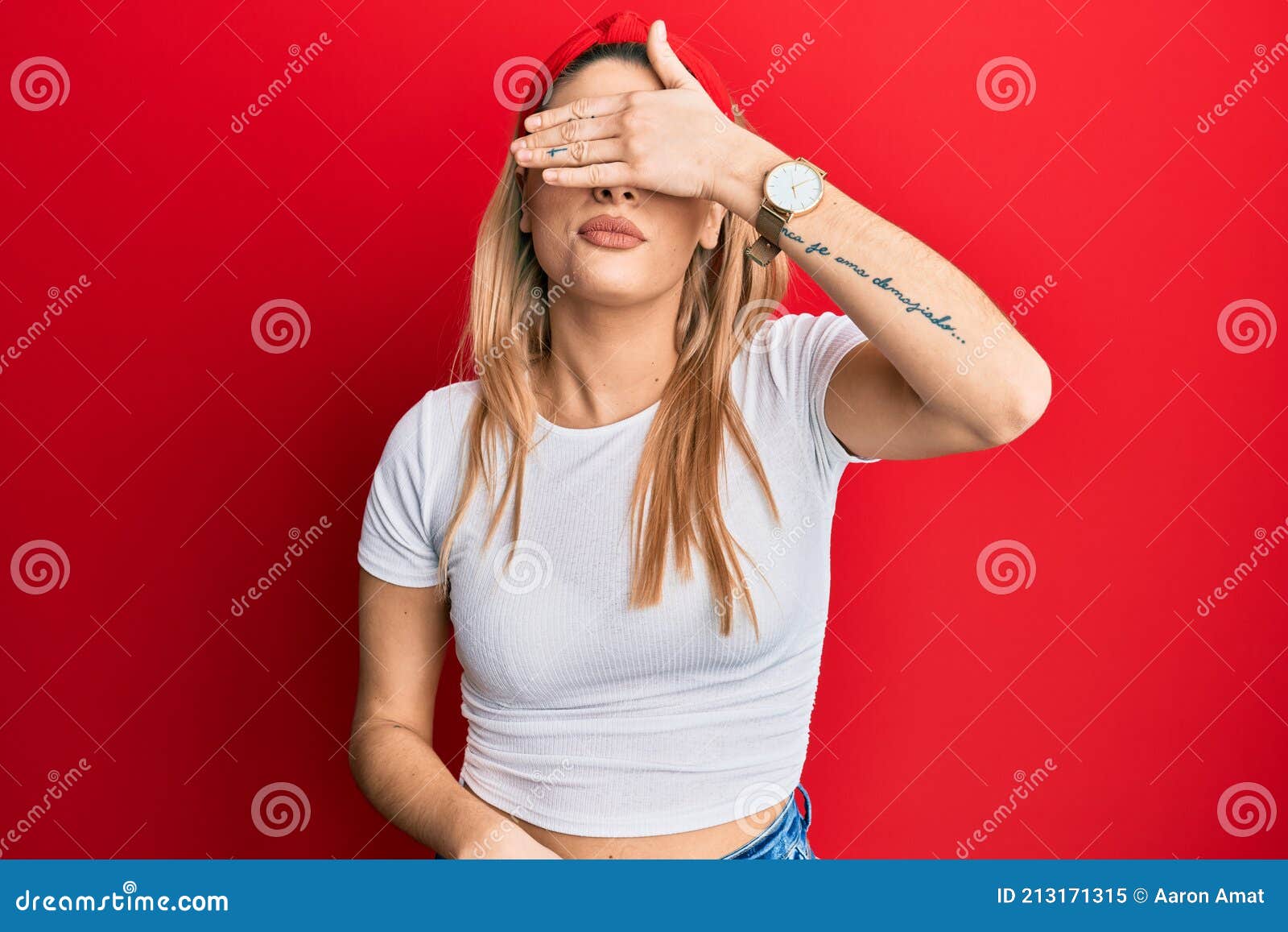 Young Caucasian Woman Wearing Casual White T Shirt Covering Eyes With