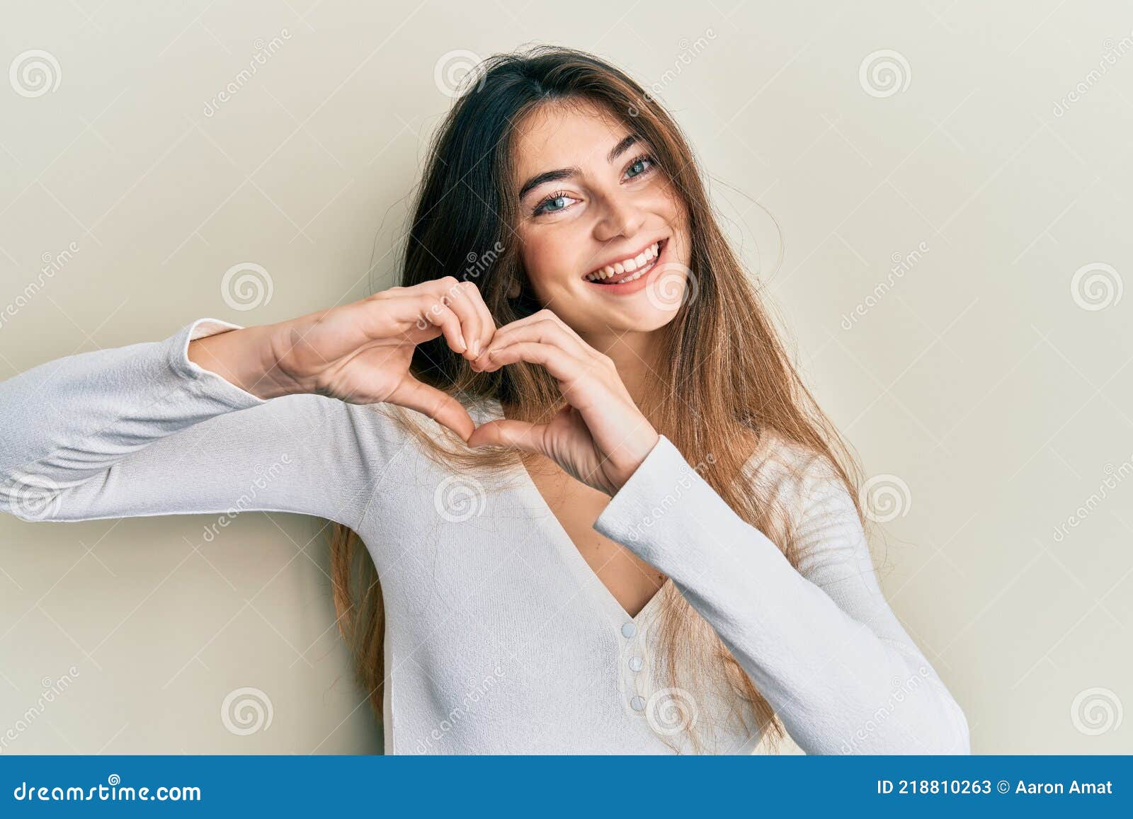 Young Caucasian Woman Wearing Casual White T Shirt Smiling In Love