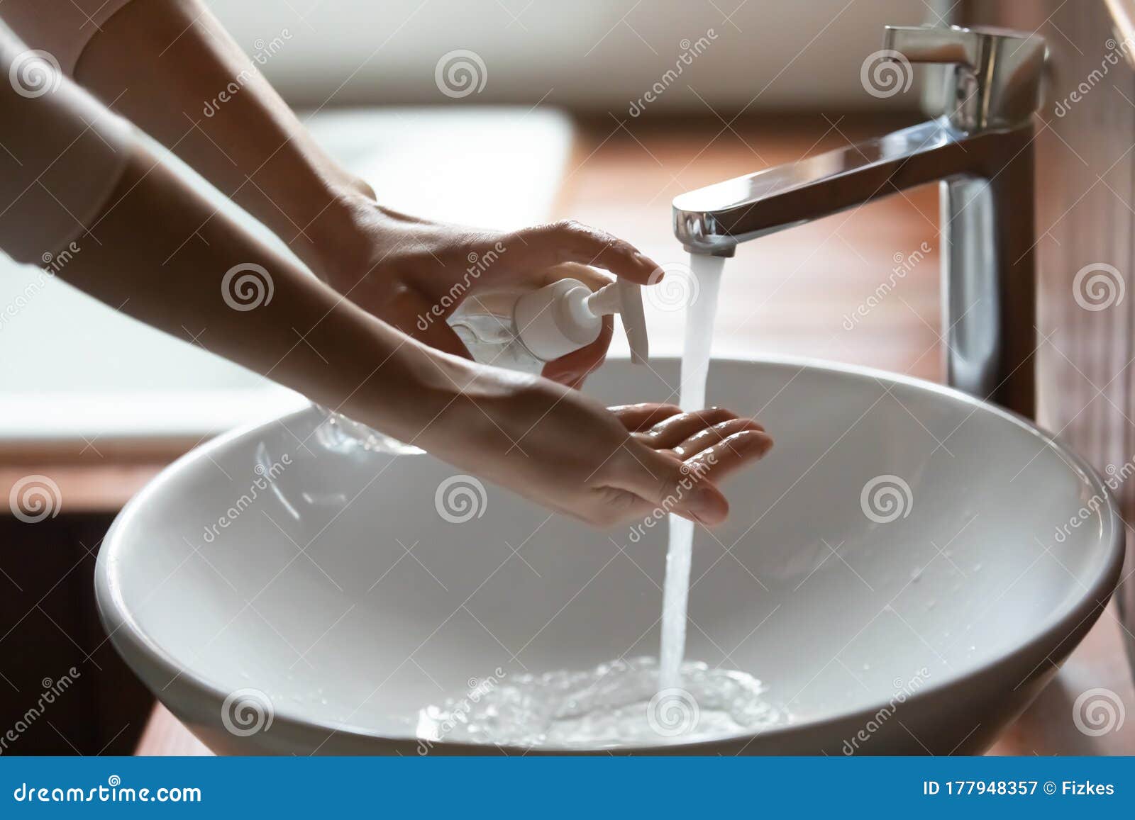 Young Cautious Woman Applying Antibacterial Soap on Hands. Stock Image ...