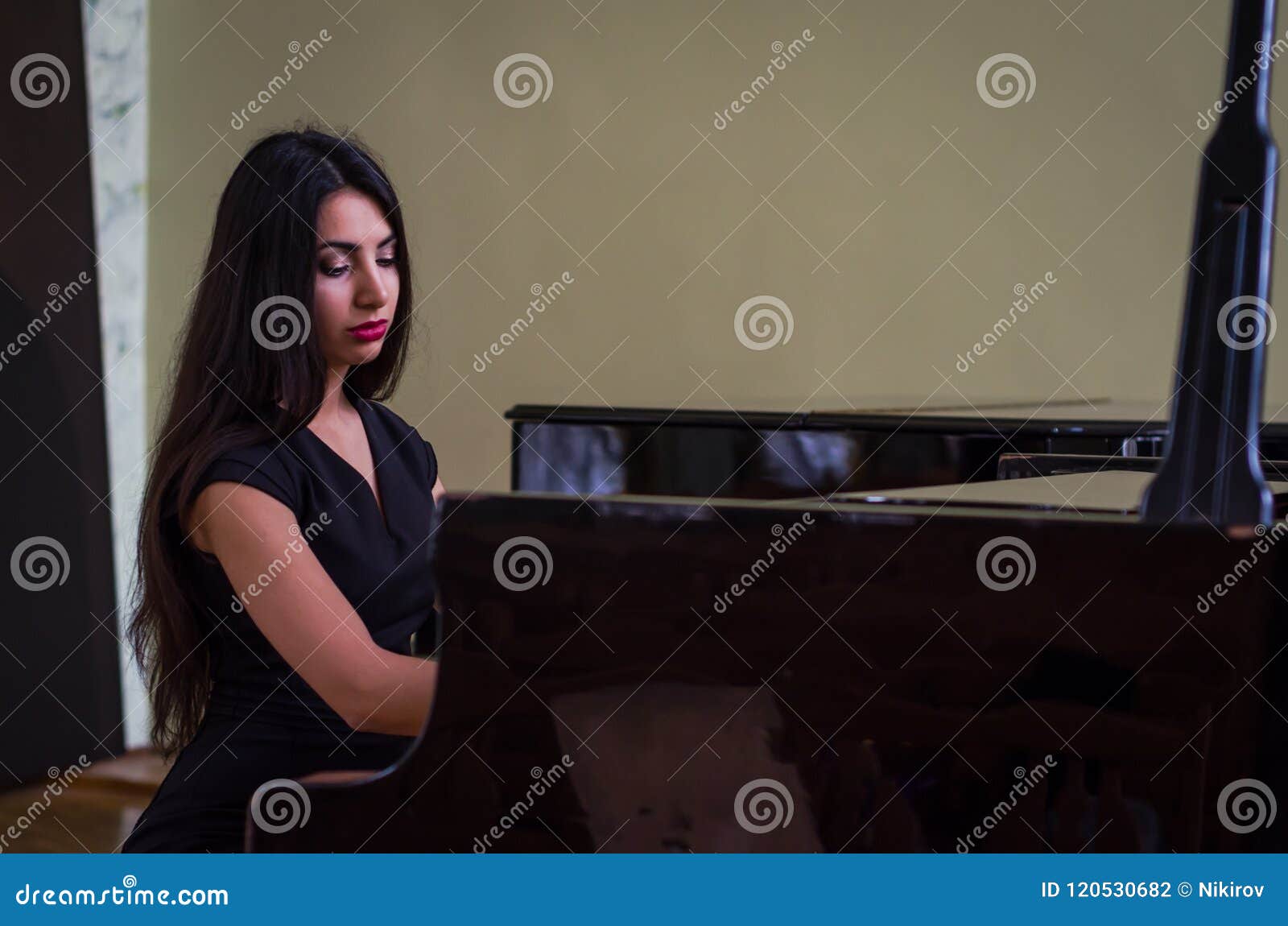 Young Charming Brunette Girl Playing the Piano Stock Photo - Image of ...