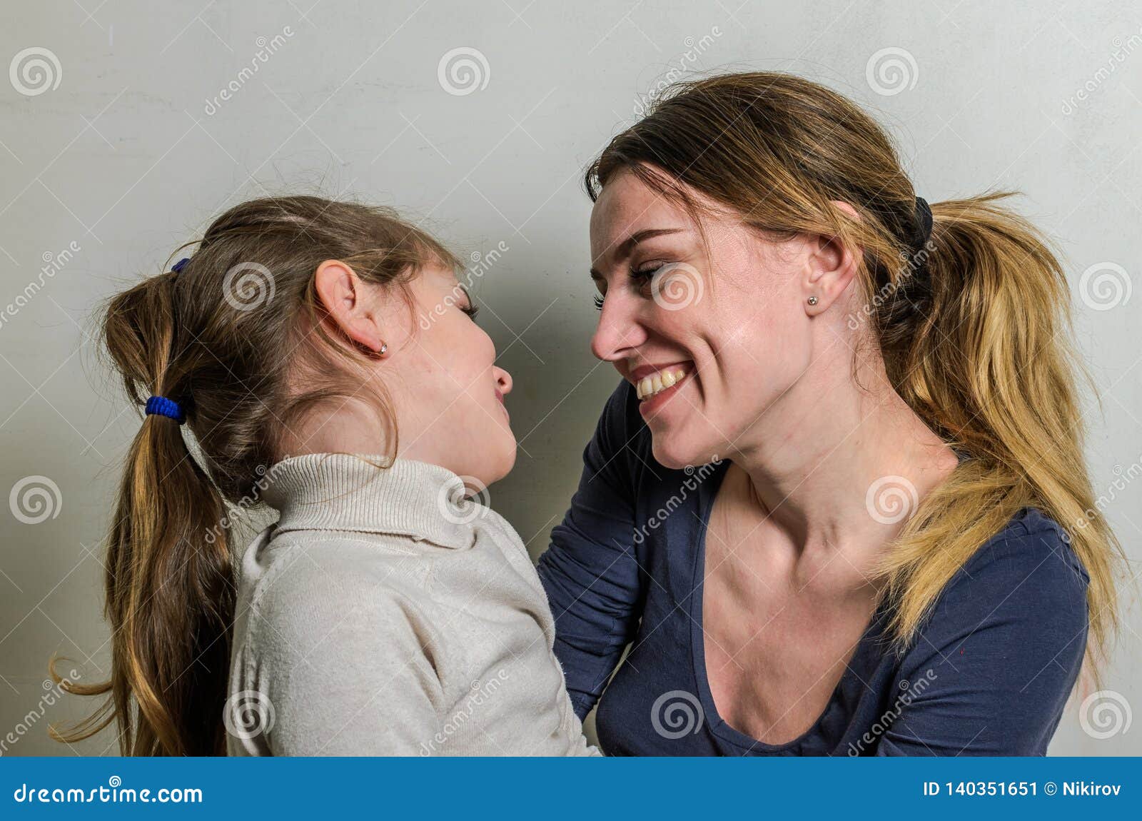 Young Charming Mother Plays with Her Daughter - Happy Family Stock ... Young Charming Mother Plays with Her Daughter - Happy Family Stock ...