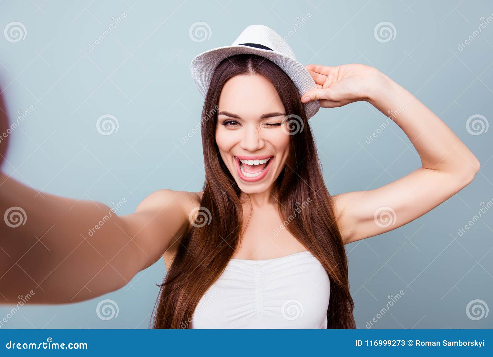 Young Cheerful Attractive Toothy Brown Haired Lady Is Smiling On Stock