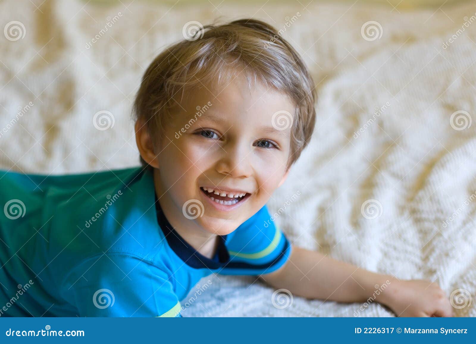Young Cheerful Boy Laying Down Stock Image - Image of generation, laugh ...