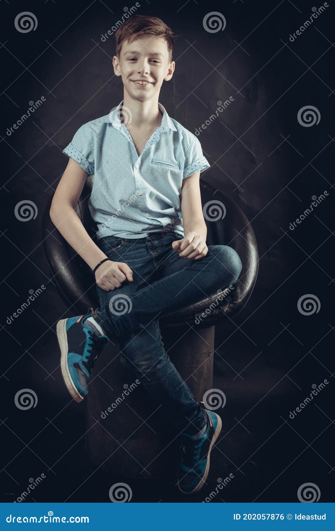 Young Cheerful Boy Sitting on Chair Studio Portrait. Stock Photo ...