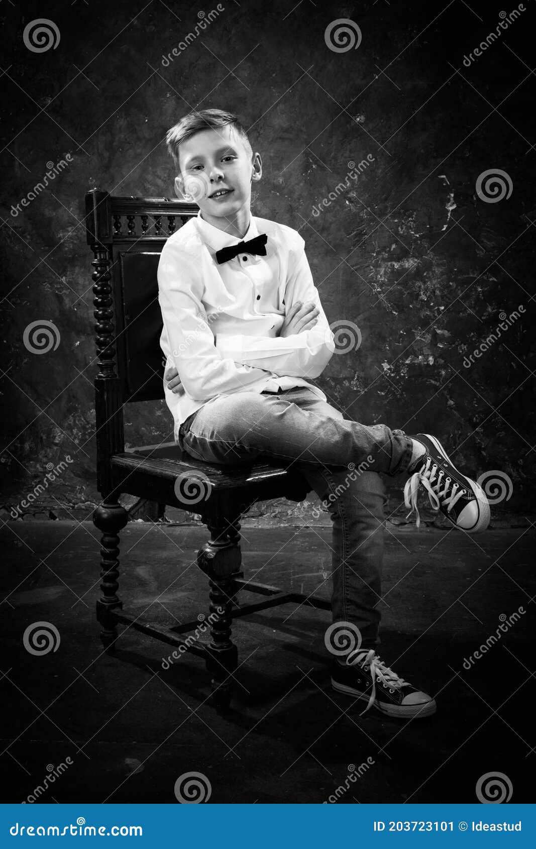 Young Cheerful Boy Sitting on Chair Studio Portrait. Stock Image ...