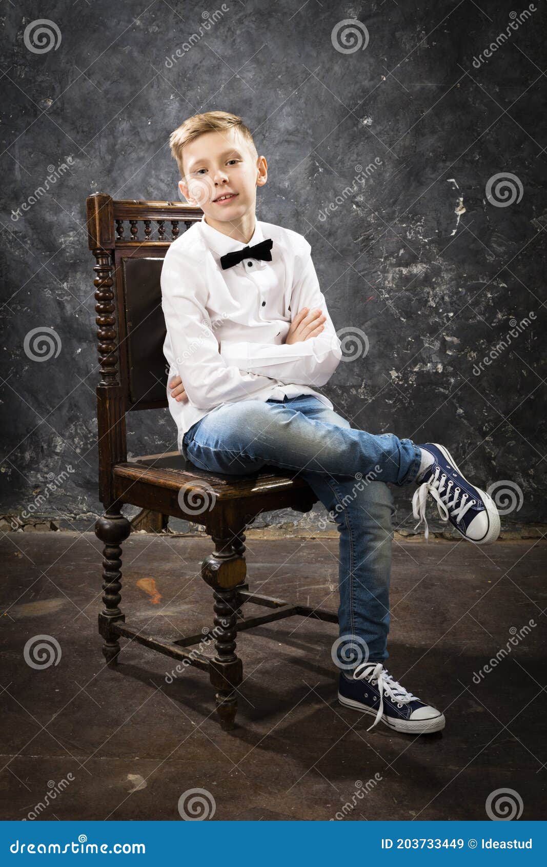 Young Cheerful Boy Sitting on Chair Studio Portrait. Stock Image ...
