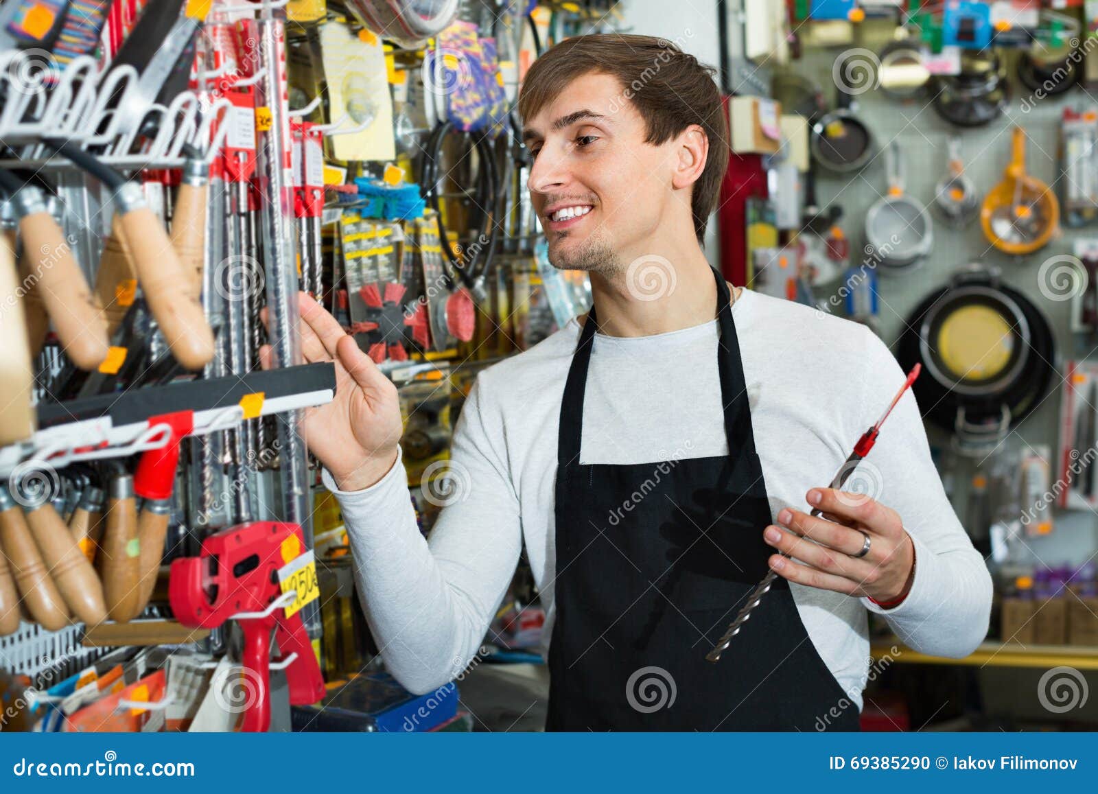 Young Cheerful Friendly Salesman Working and Smiling Stock Photo ...