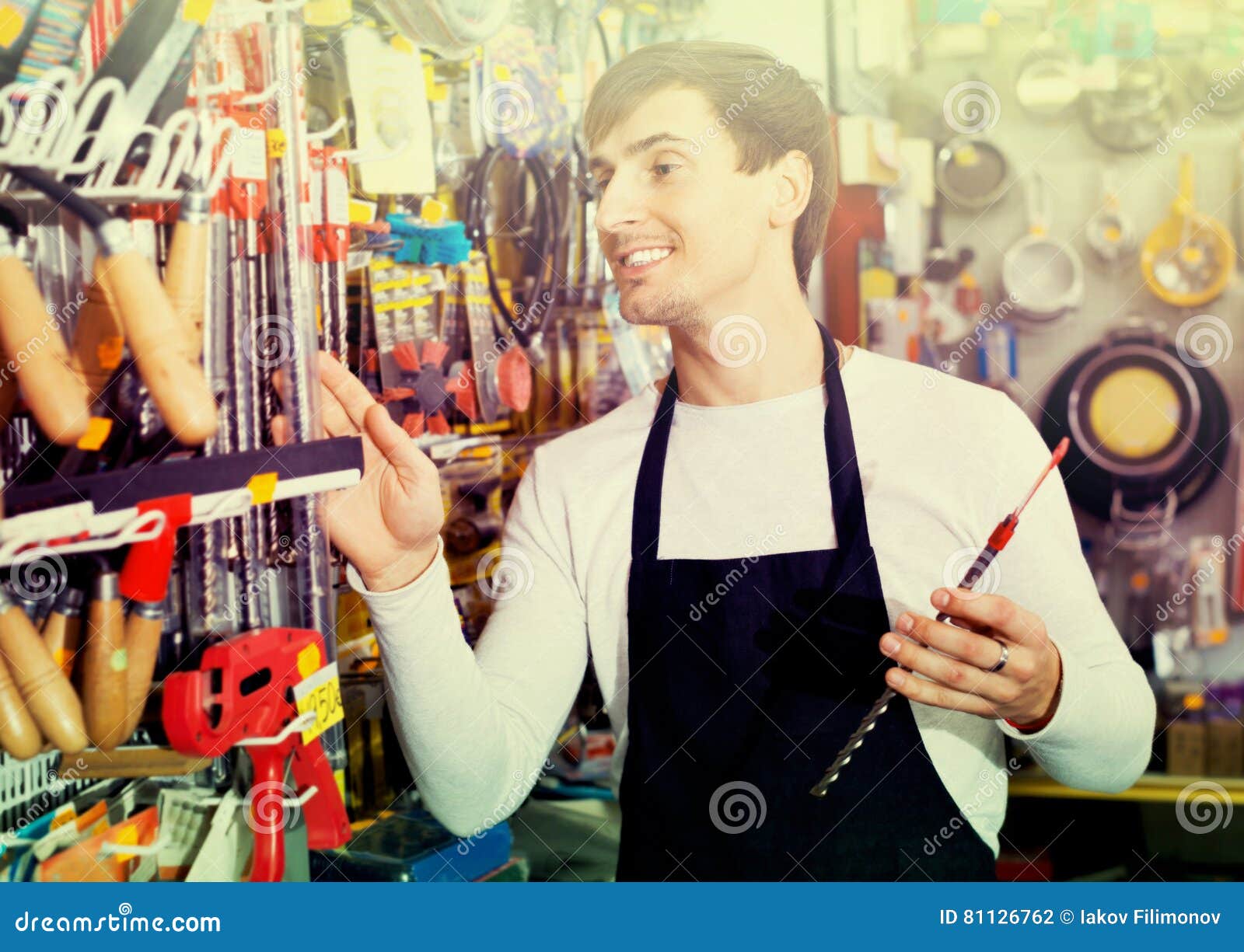 Young Cheerful Friendly Salesman Working and Smiling Stock Photo ...