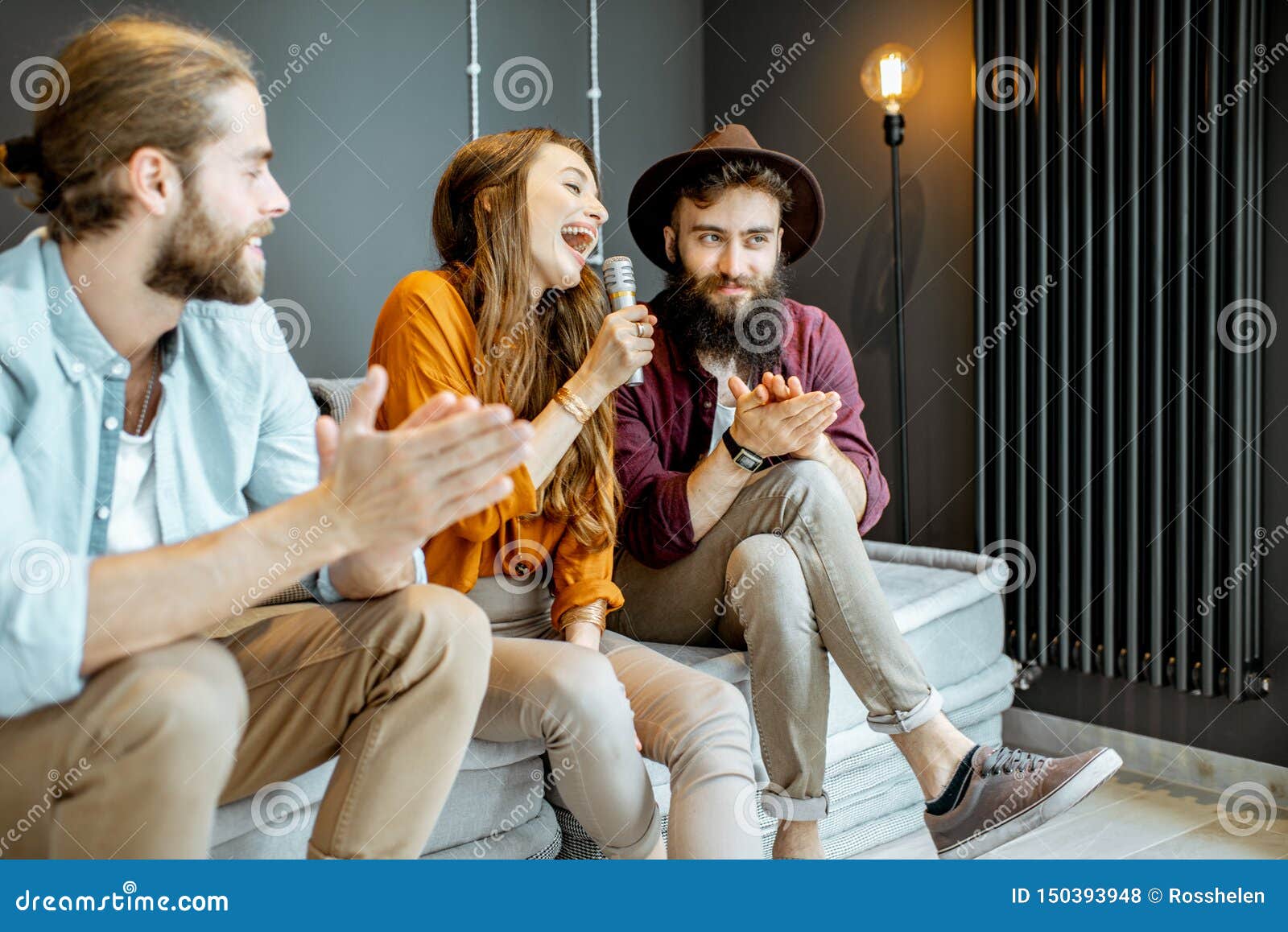Friends singing at home stock photo. Image of karaoke - 150393948