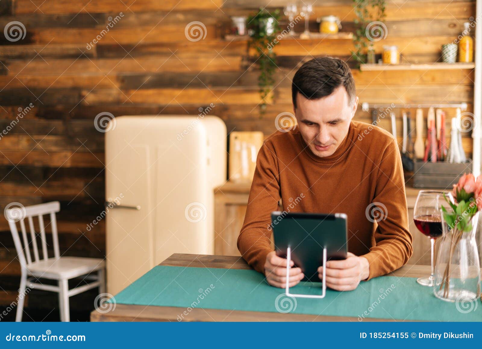 Young Cheerful Man Using Tablet Computer Having Online Video Chat with ...