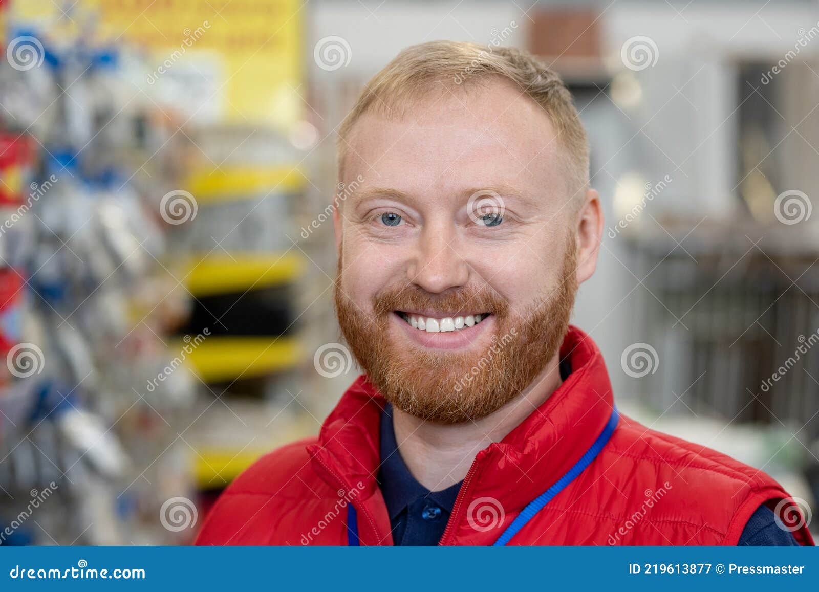 Young Cheerful Shop Assistant in Red Uniform Stock Image - Image of ...