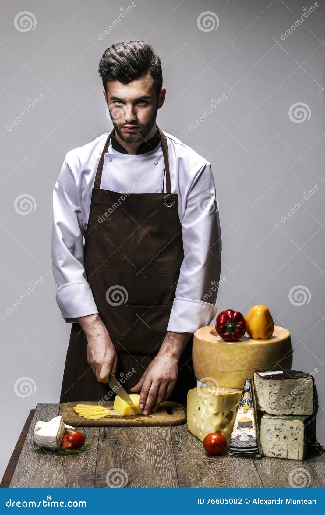 Young chef with cheeses stock photo. Image of delicates - 76605002