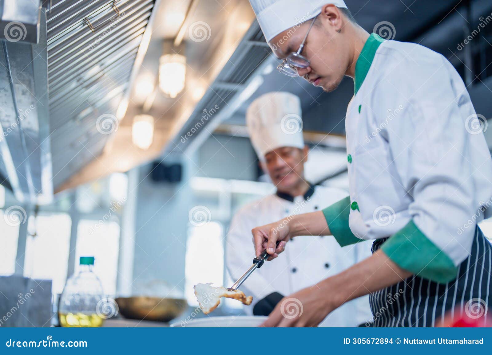 Young Chef Cooking at Restaurant Kitchen Stock Photo - Image of ...