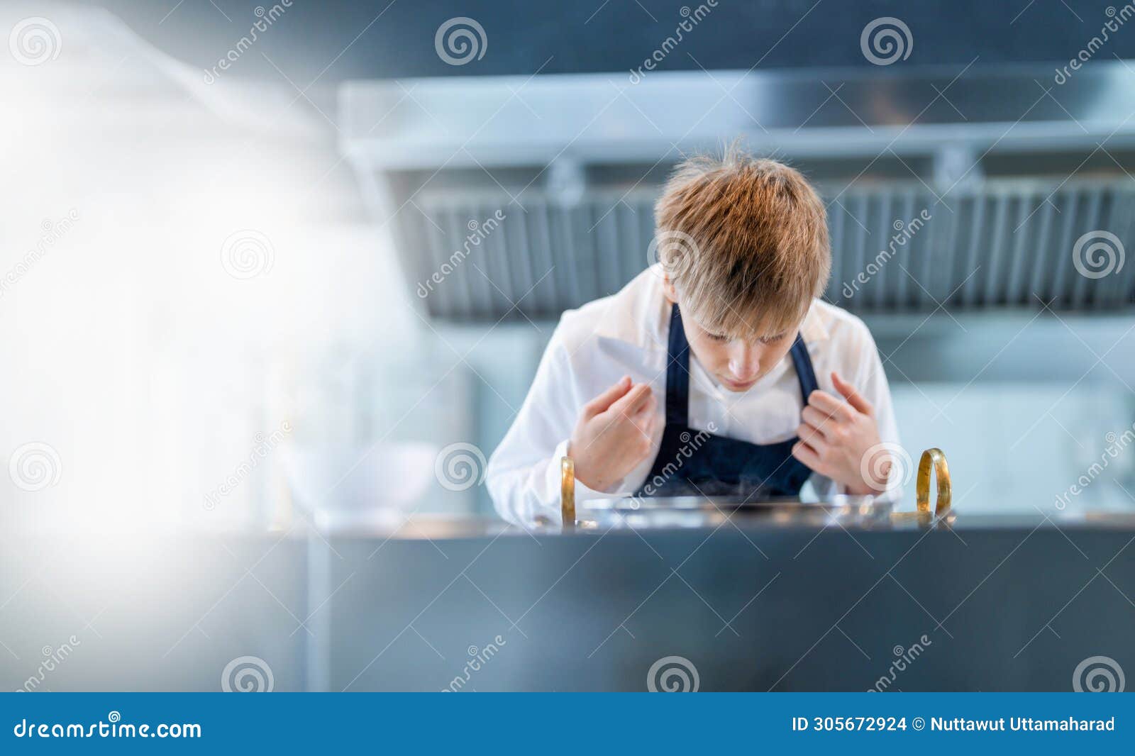 Young Chef Cooking at Restaurant Kitchen Stock Photo - Image of ...