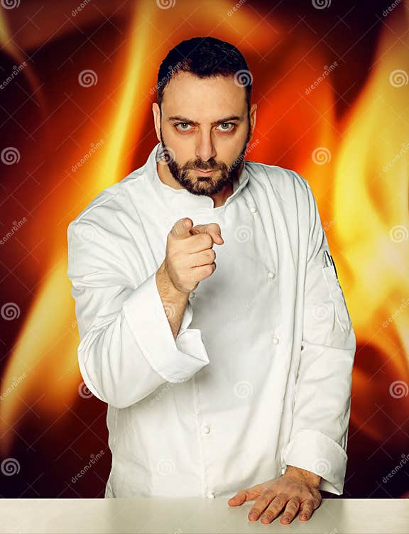Young Chef on Fiery Background Stock Image - Image of finger, male ...