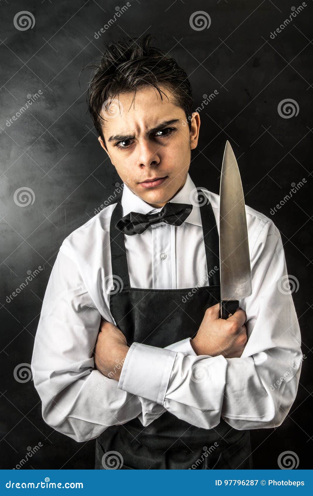 An young chef with knife stock image. Image of funny - 97796287