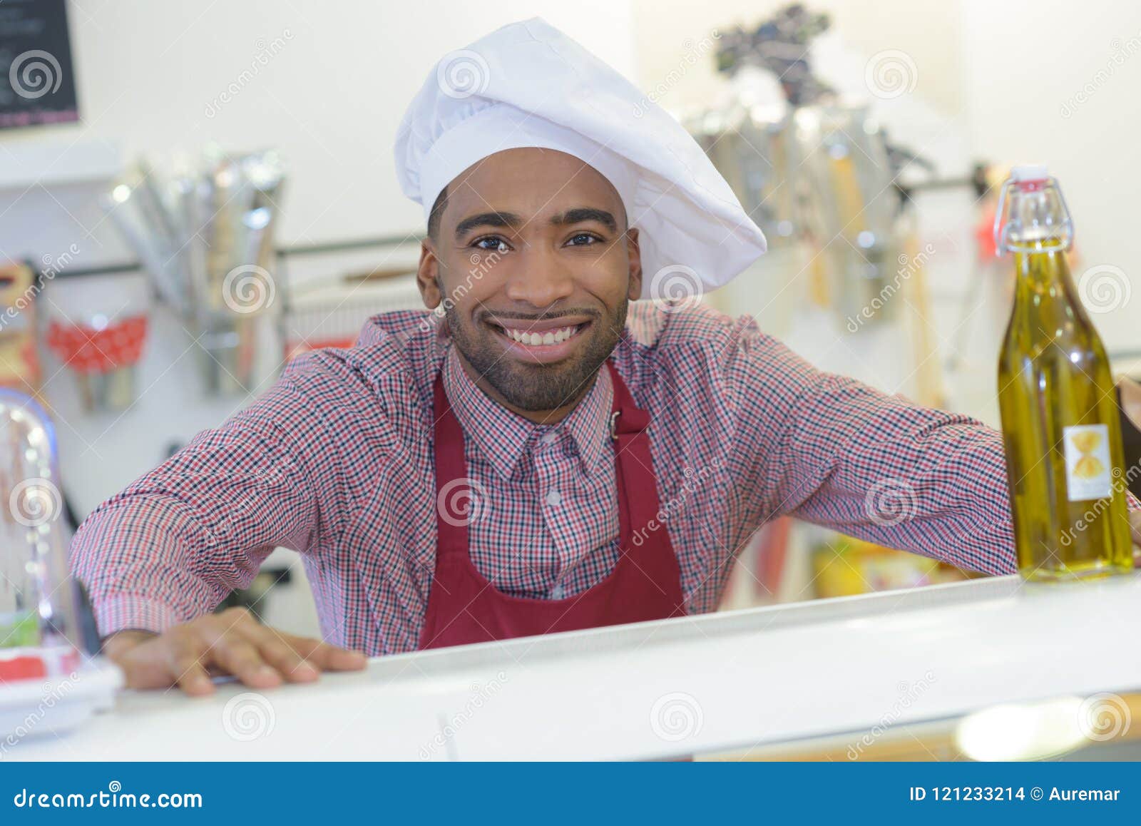 Young Chef Leaning on Kitchen Counter Stock Photo - Image of background ...