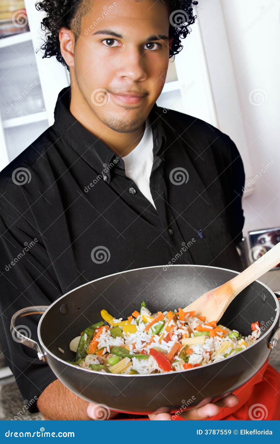 Young chef with wok stock image. Image of home, stirfry - 3787559