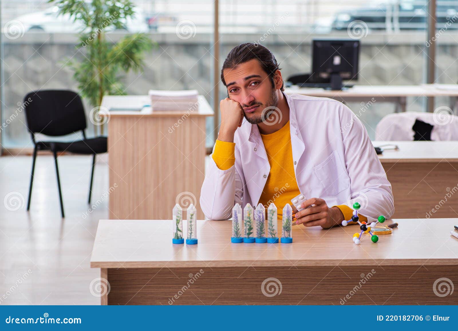 Young Male Chemist in Drug Synthesis Concept Stock Photo - Image of ...