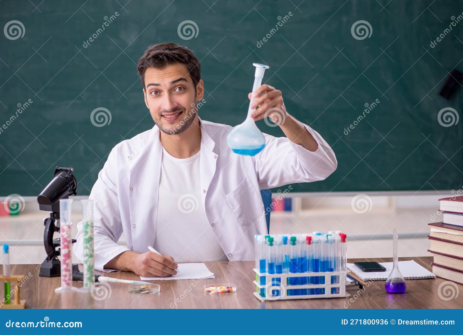 Young Male Chemist in Front of Green Board Stock Photo - Image of ...