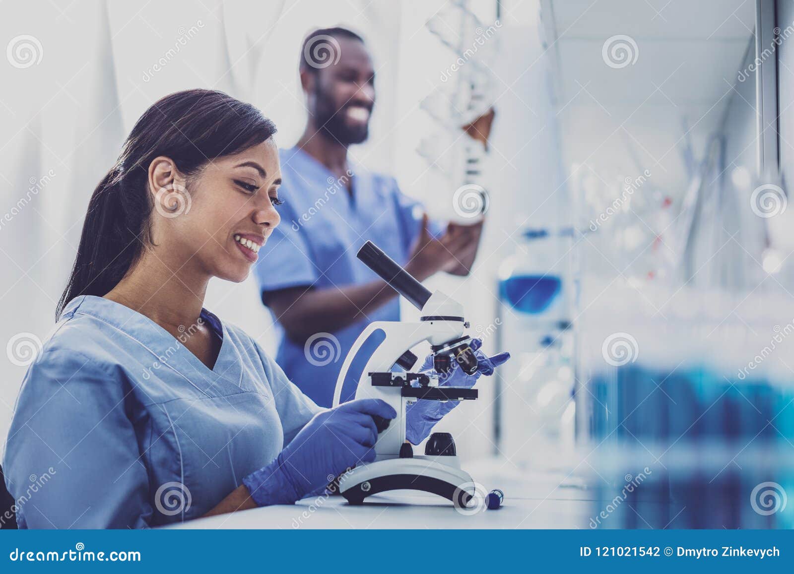 Professional Young Chemist Using Microscope Stock Photo - Image of ...