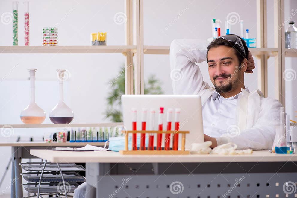 Young Male Chemist Sitting at Computer at the Lab Stock Image - Image ...